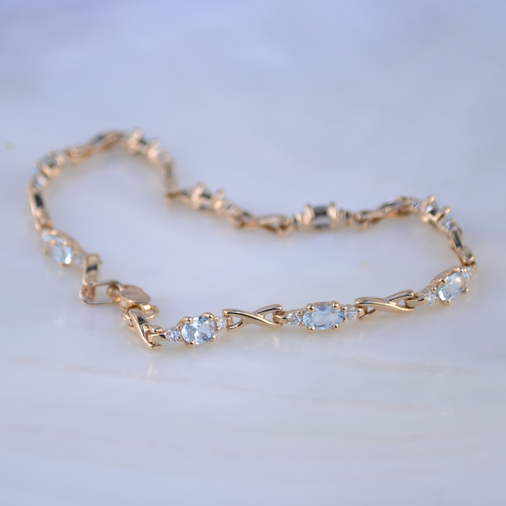 Женский браслет из красного золота с топазами и бриллиантами (цена за ...